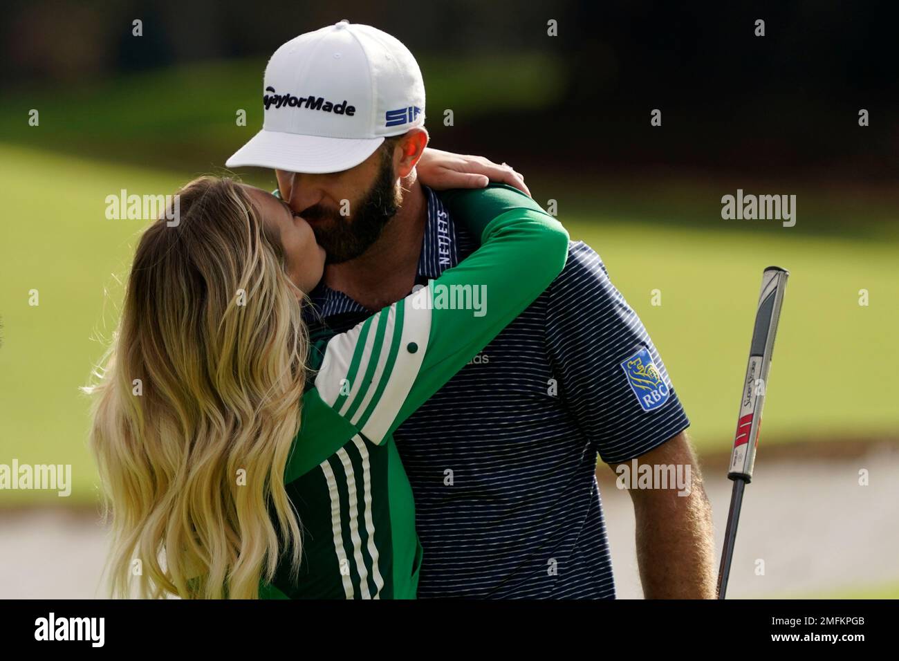 Dustin Johnson is hugged by Paulina Gretzky after winning the Masters ...