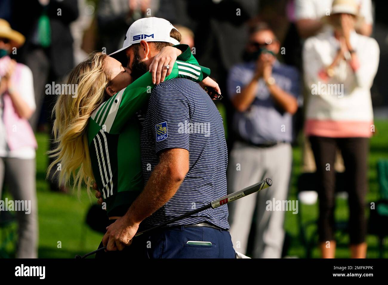 Dustin Johnson is hugged by Paulina Gretzky after winning the Masters ...