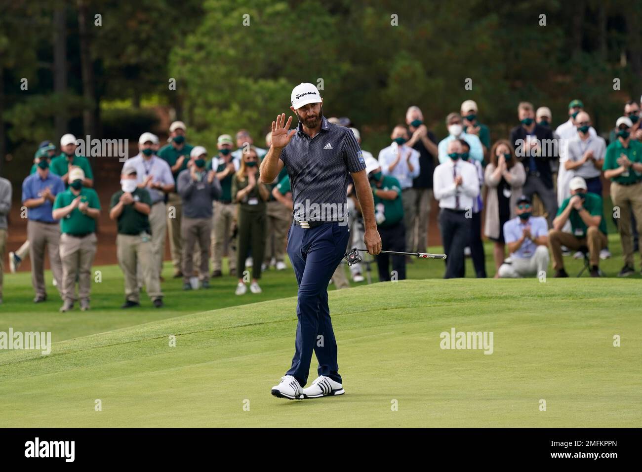 Dustin Johnson waves after winning the Masters golf tournament Sunday ...