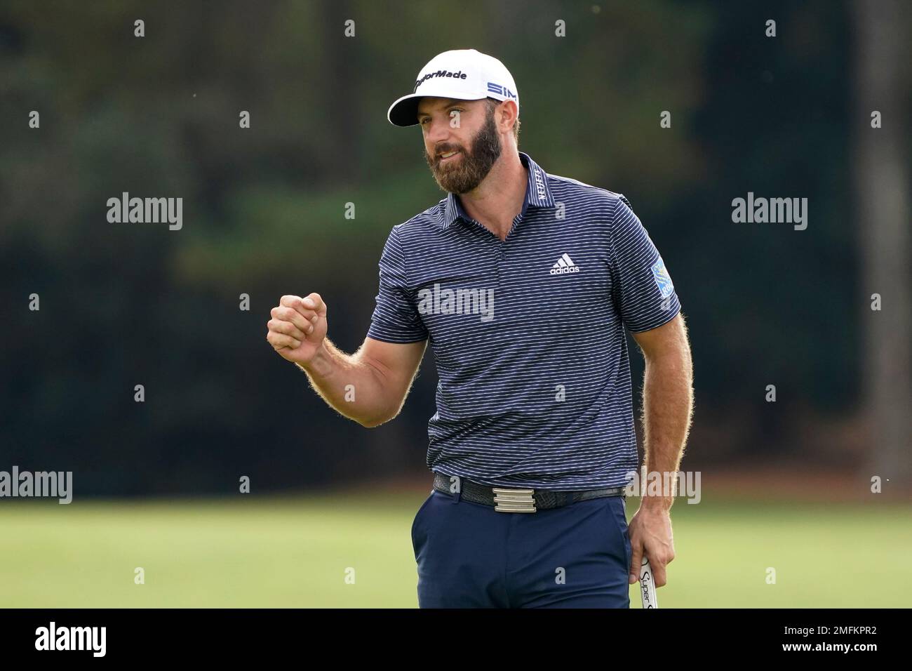 Dustin Johnson pumps his fist after wining the the Masters golf ...