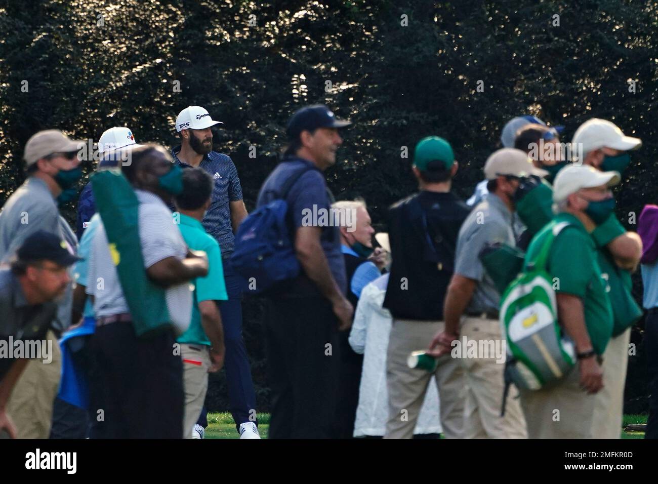 Spectators watch Dustin Johnson's tee shot on the 16th hole during the ...