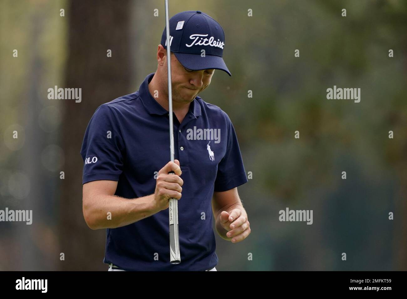 Justin Thomas reacts after his putt on the sixth green during the final ...