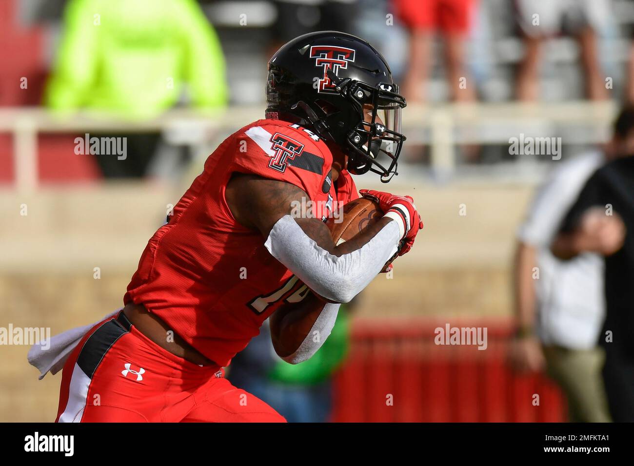 Texas Tech running back Xavier White (14) runs the ball against Baylor ...