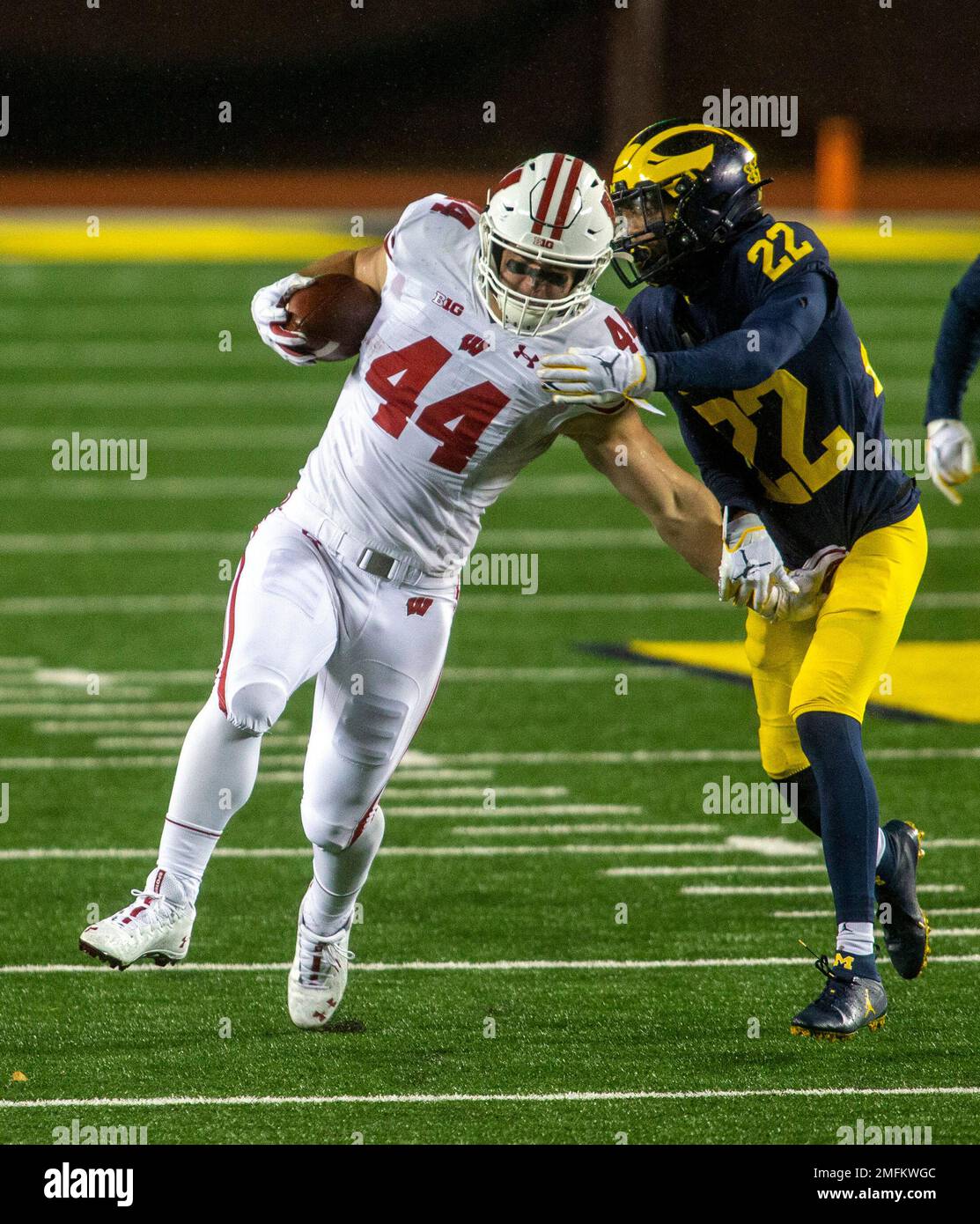 Wisconsin fullback John Chenal (44) rushes, defended by Michigan ...