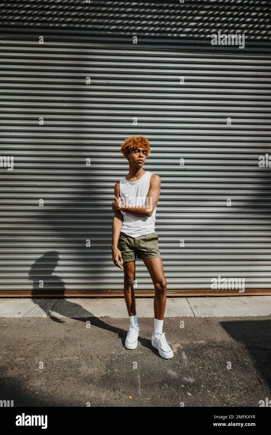 Vertical portrait of handsome teen man with nice appearance and stylish ...