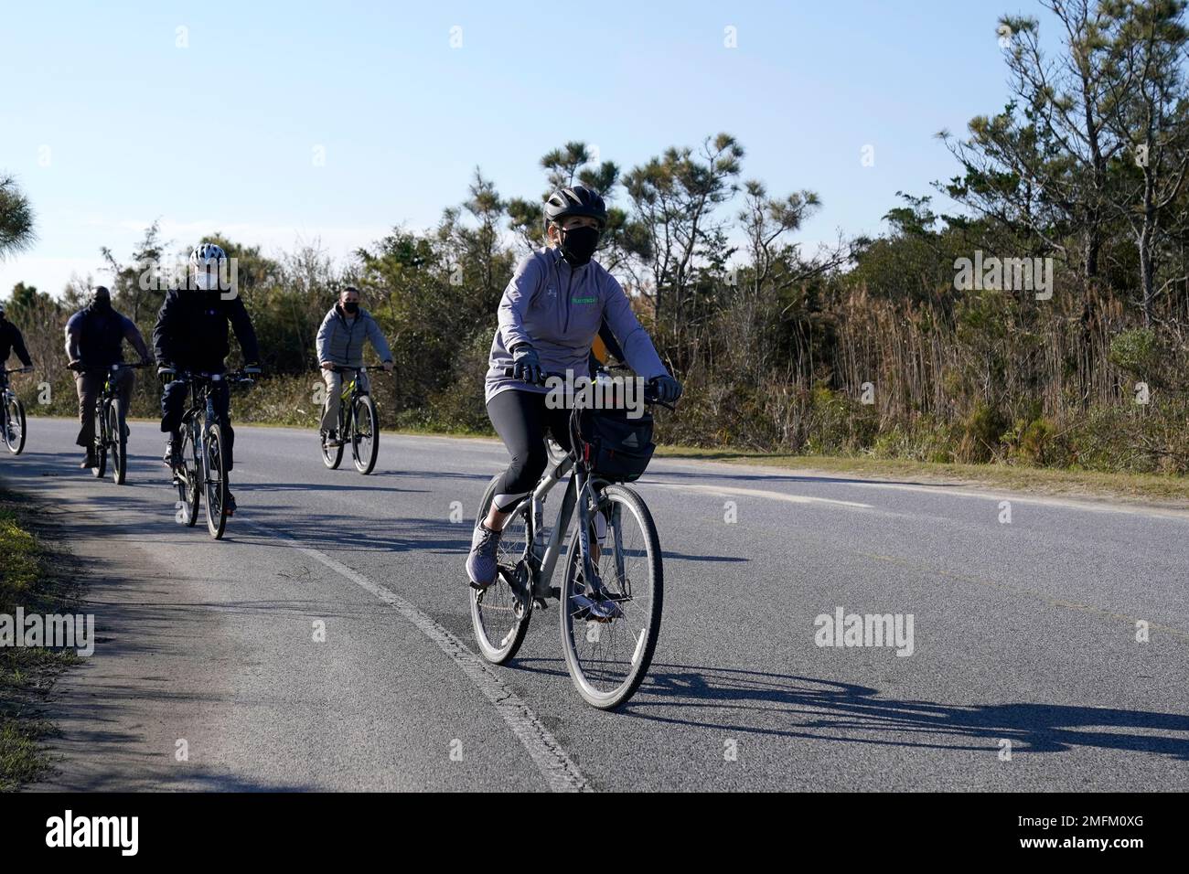 President-elect Joe Biden rides a bike with his wife Jill at Cape ...