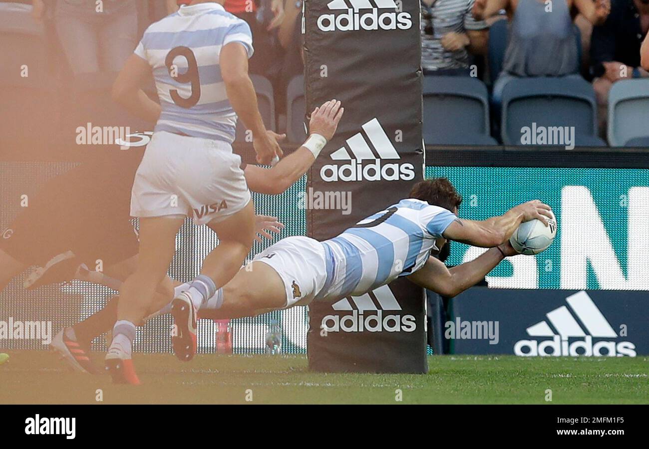 Argentina's Nicolas Sanchez dives across the line to score his team's ...