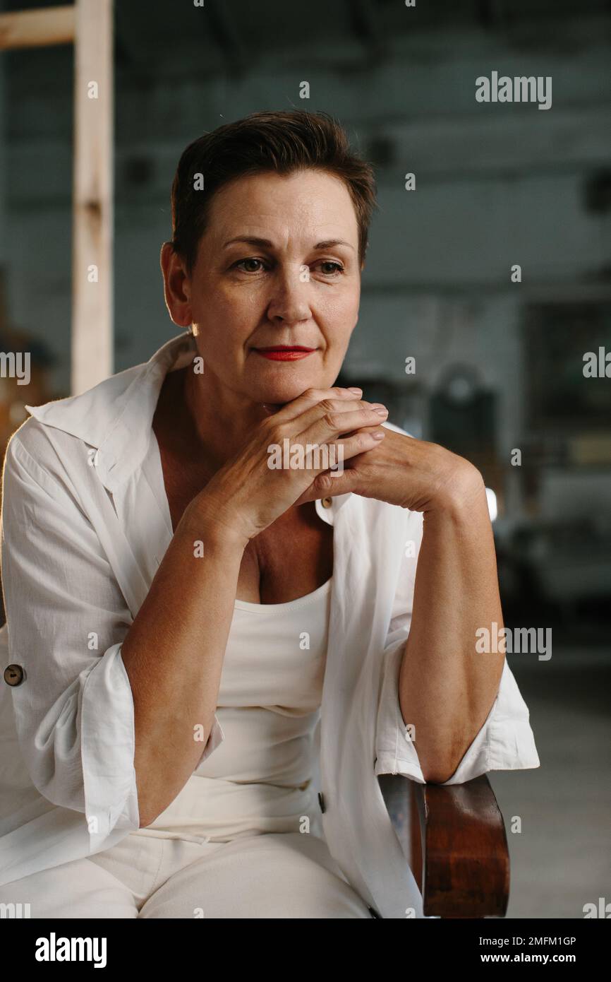 A mature woman poses in a film studio. Emotional portrait of the ...