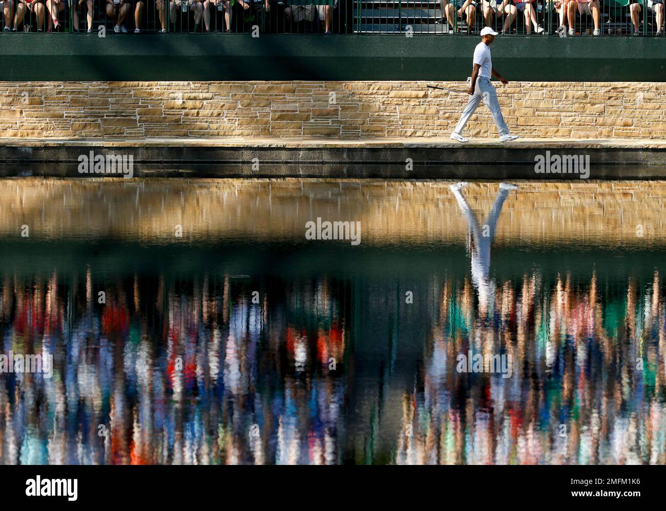Tiger Woods walks to the 15th green during practice for the Masters ...