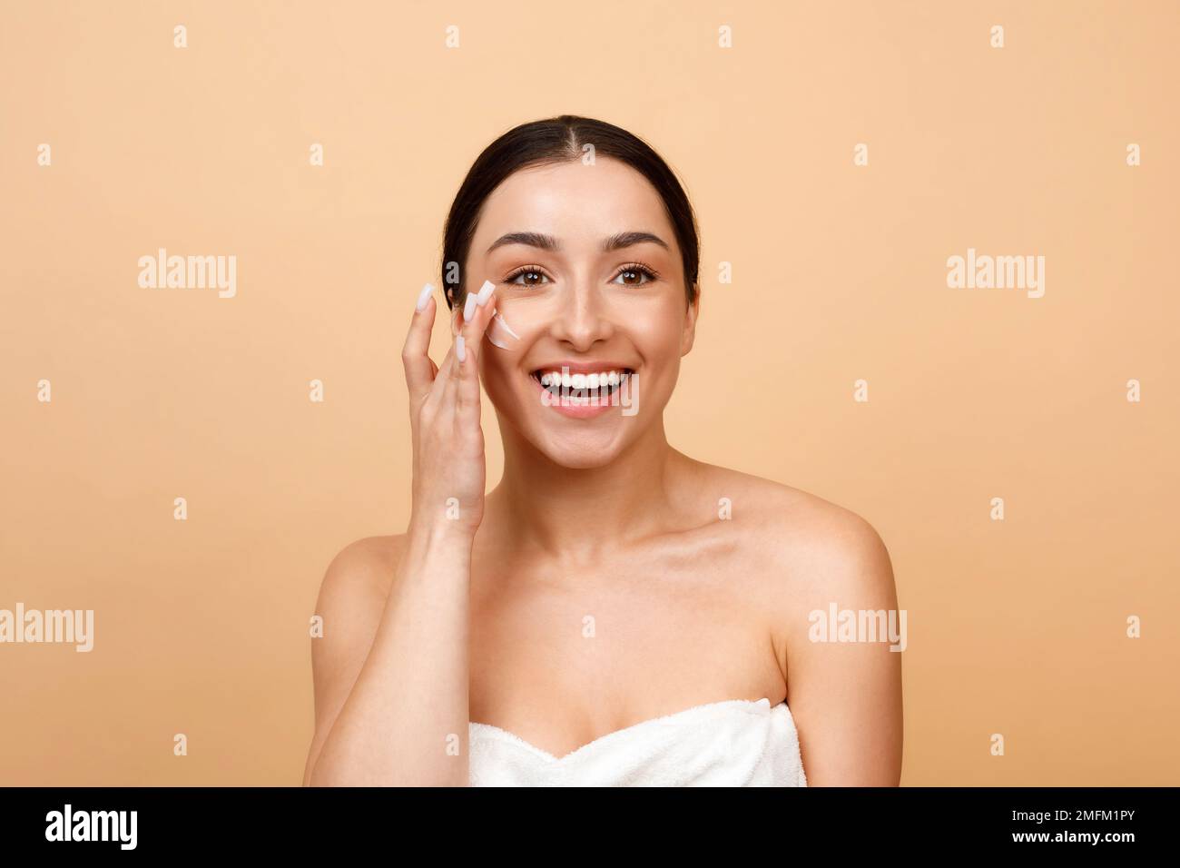 Skincare Routine. Happy Young Indian Woman Applying Moisturizing Cream ...