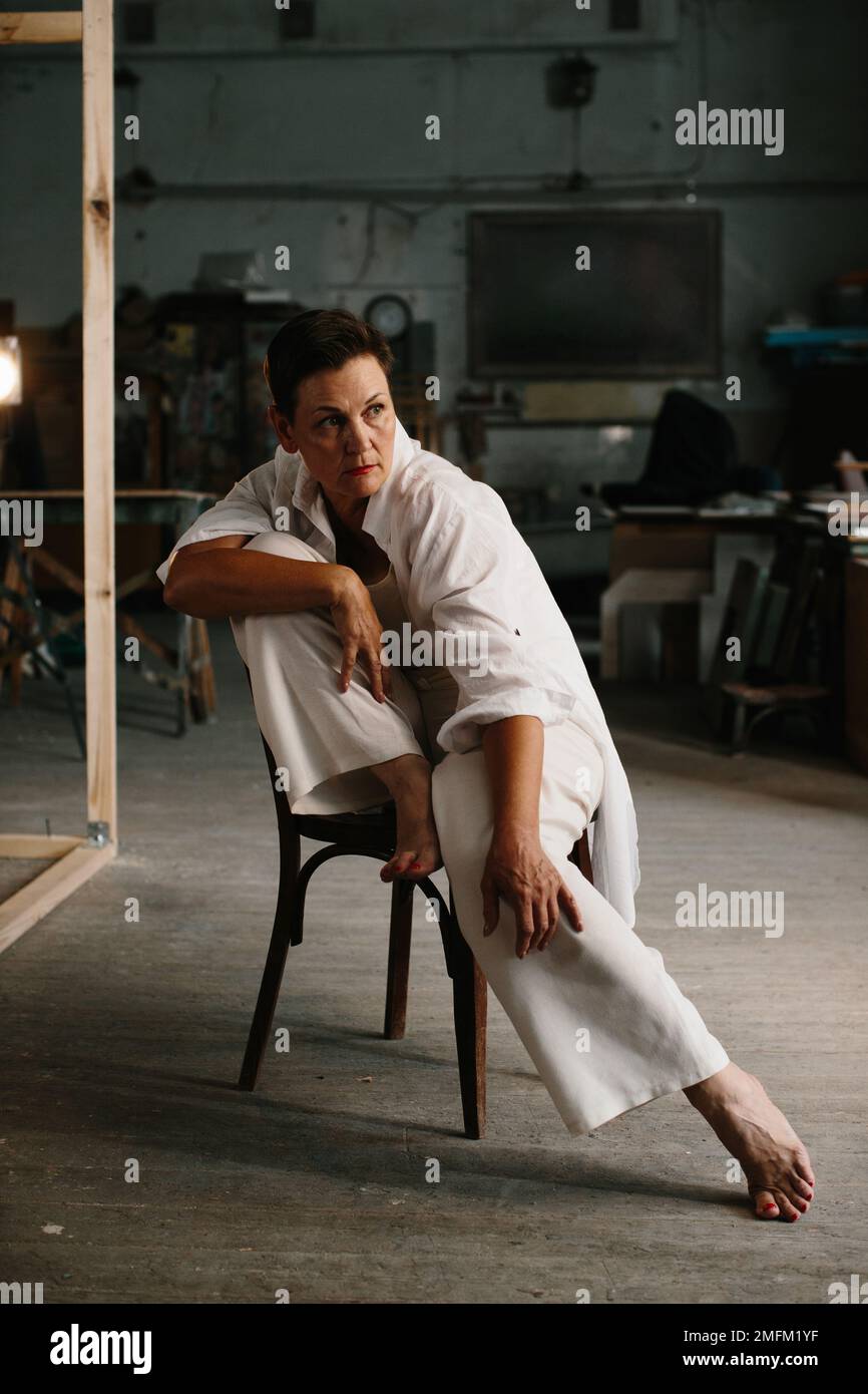 A mature woman poses in a film studio Stock Photo - Alamy