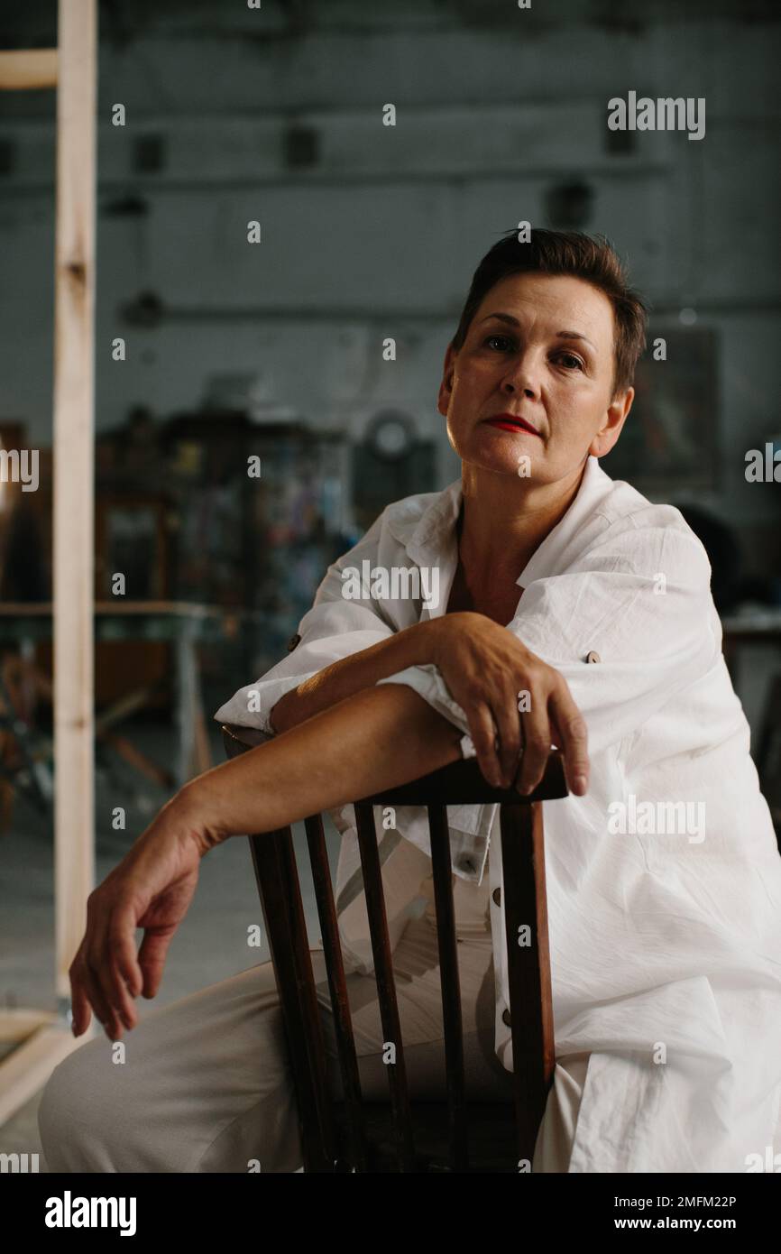 A mature woman poses in a film studio. Emotional portrait of the ...