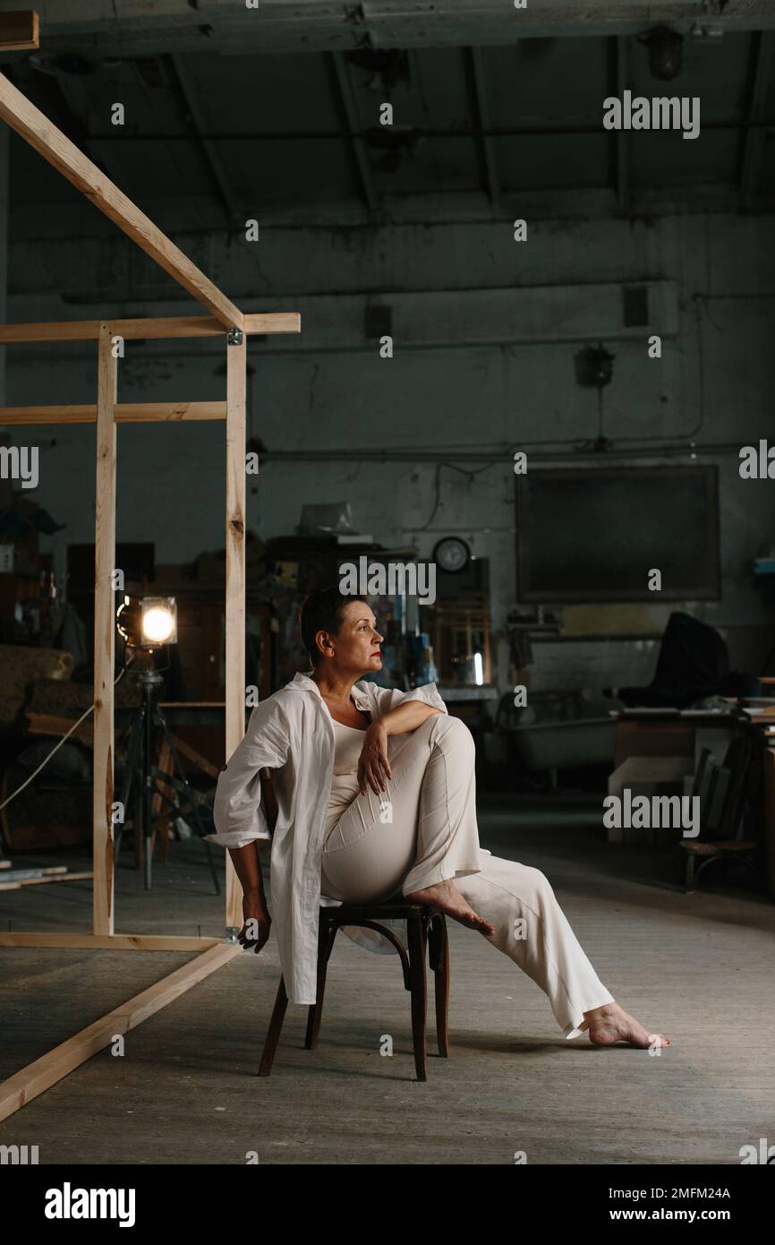 A mature woman poses in a film studio Stock Photo - Alamy