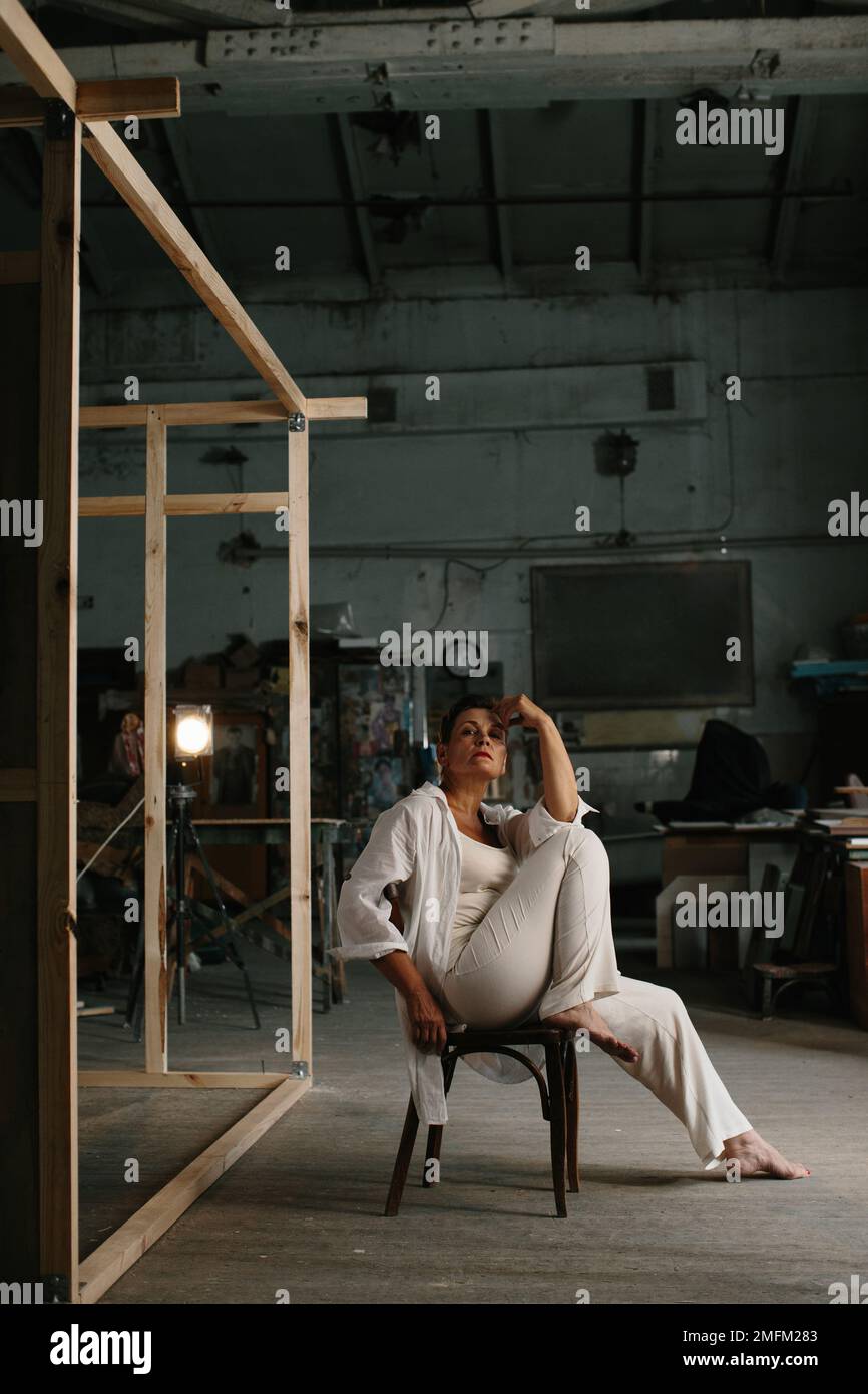 A mature woman poses in a film studio Stock Photo - Alamy