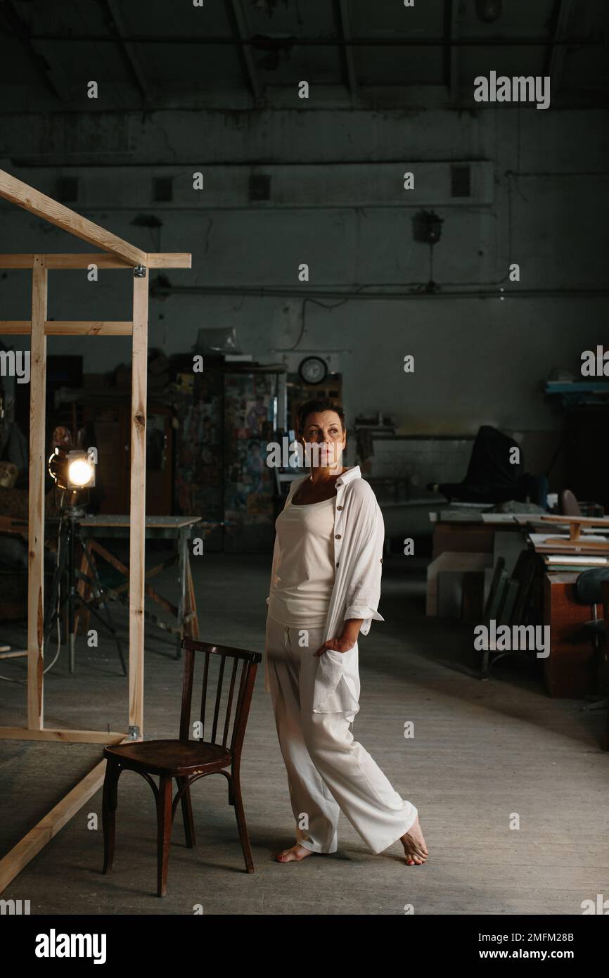 A mature woman poses in a film studio Stock Photo - Alamy
