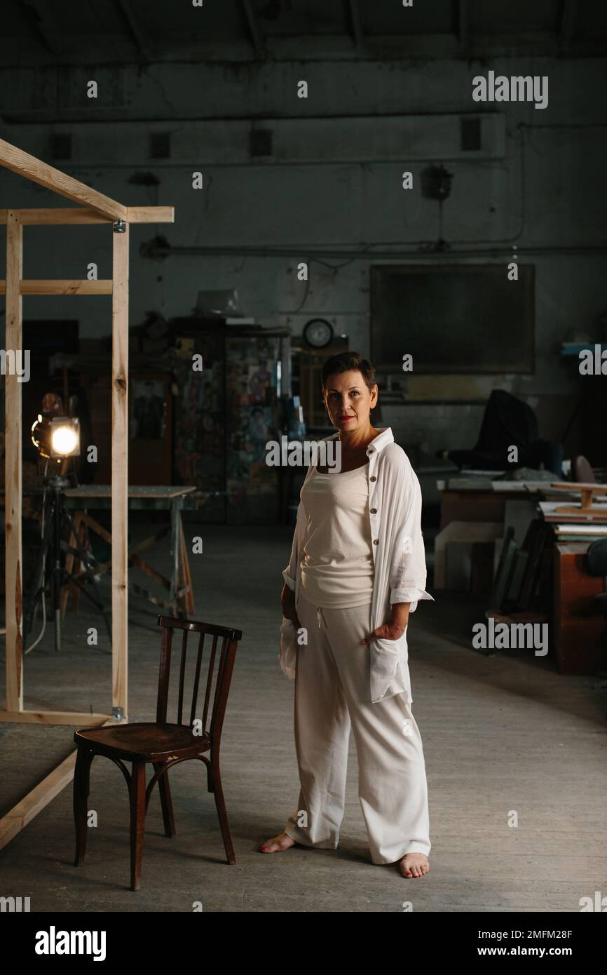 A mature woman poses in a film studio Stock Photo - Alamy
