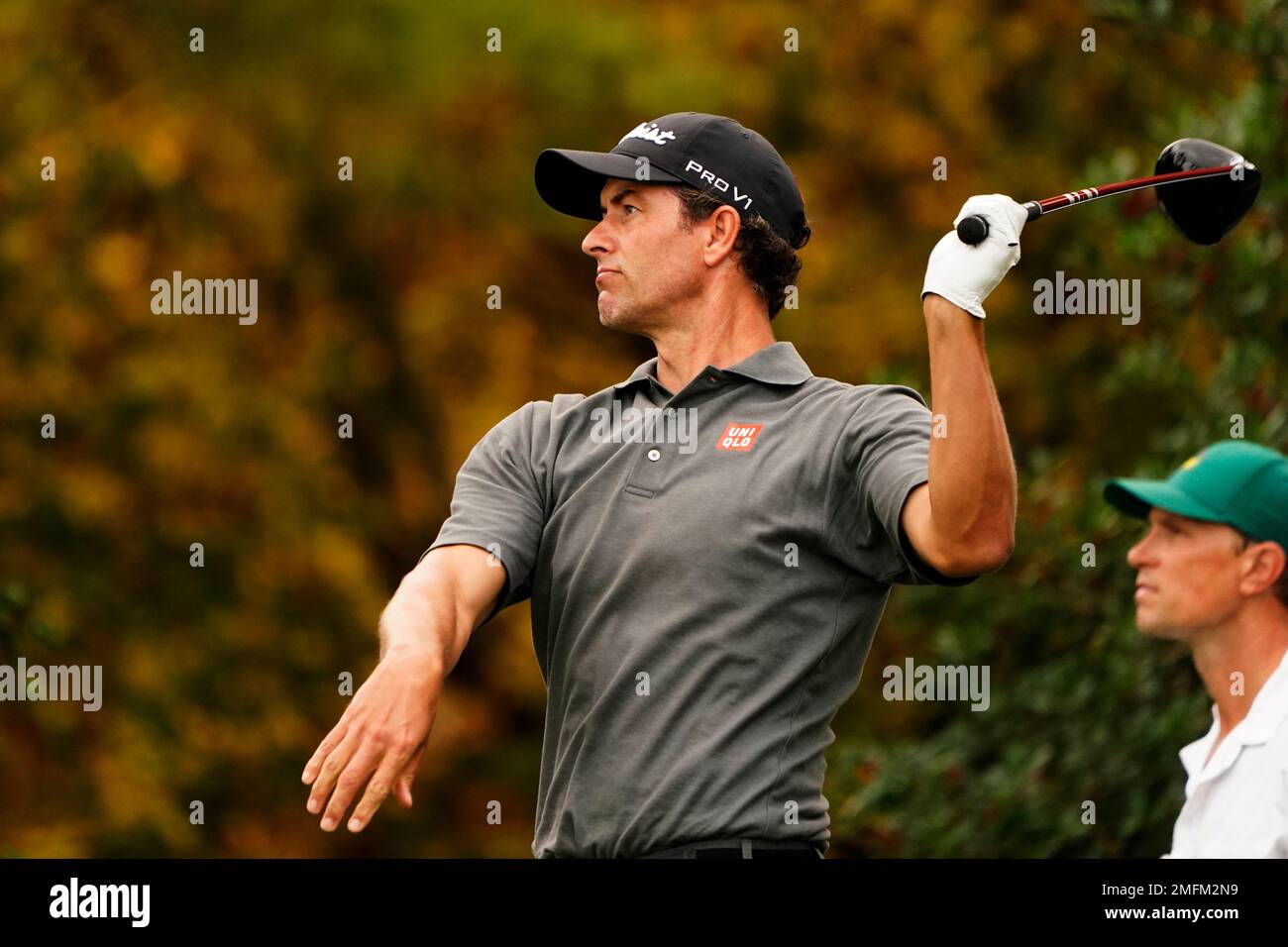Adam Scott, of Australia, watches his tee shot on the 18th hole during ...