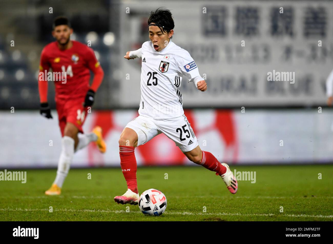 Japan's Koji Miyoshi takes a shot during the international friendly ...