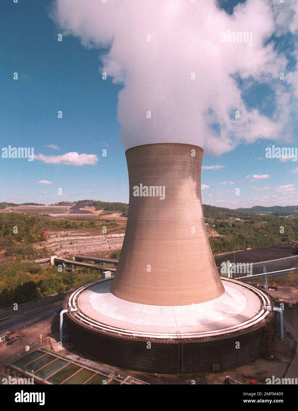 FILE - This Wednesday, Sept. 22, 1999, file photo shows a steam cooling ...