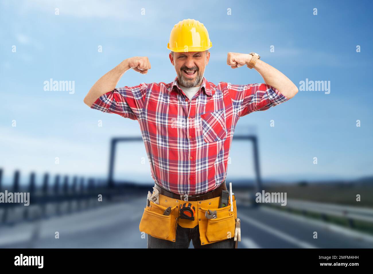 Positive worker making tension gesture with hands as success concept on ...