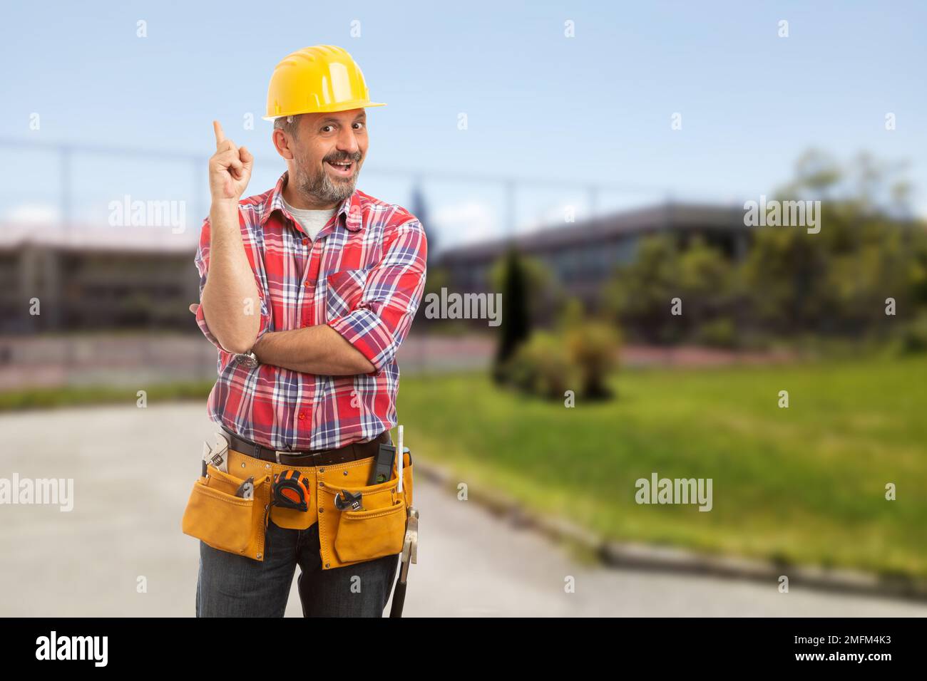 Positive man making pointing gesture with finger as eureka concept ...