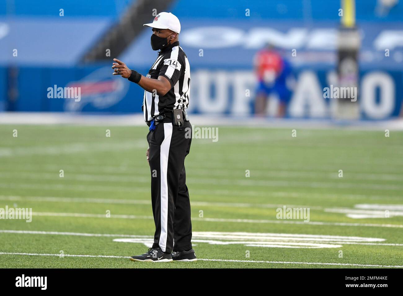 Referee Shawn Smith (14) signals during the second half of an NFL ...