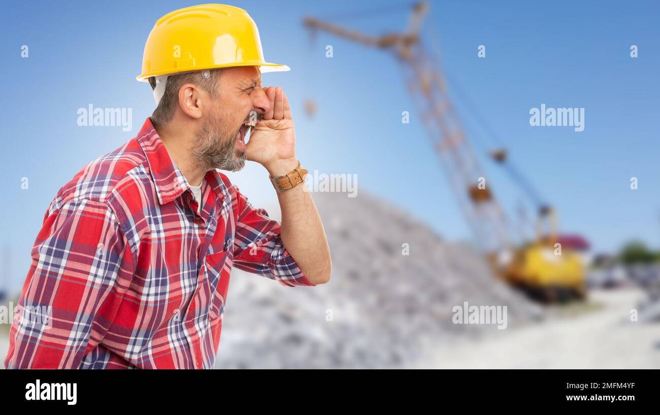 Close-up of worker making sound amplification gesture with hands as ...