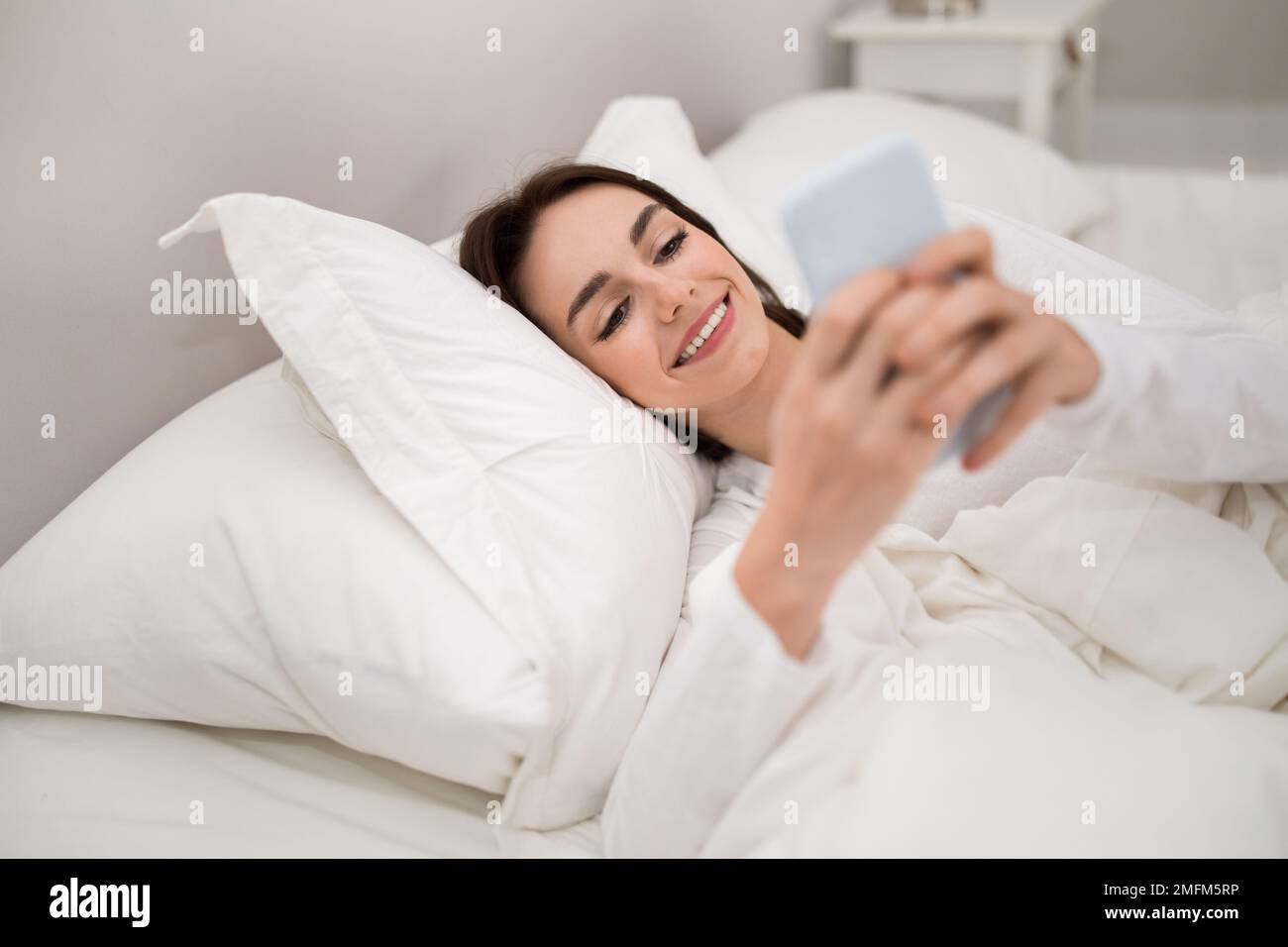 Bed woman young call hi-res stock photography and images - Alamy