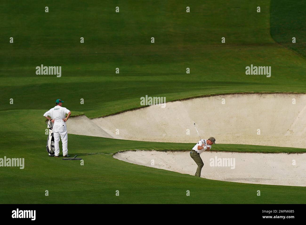 Paul Casey, of England, hits out of a bunker on the eighth hole during ...