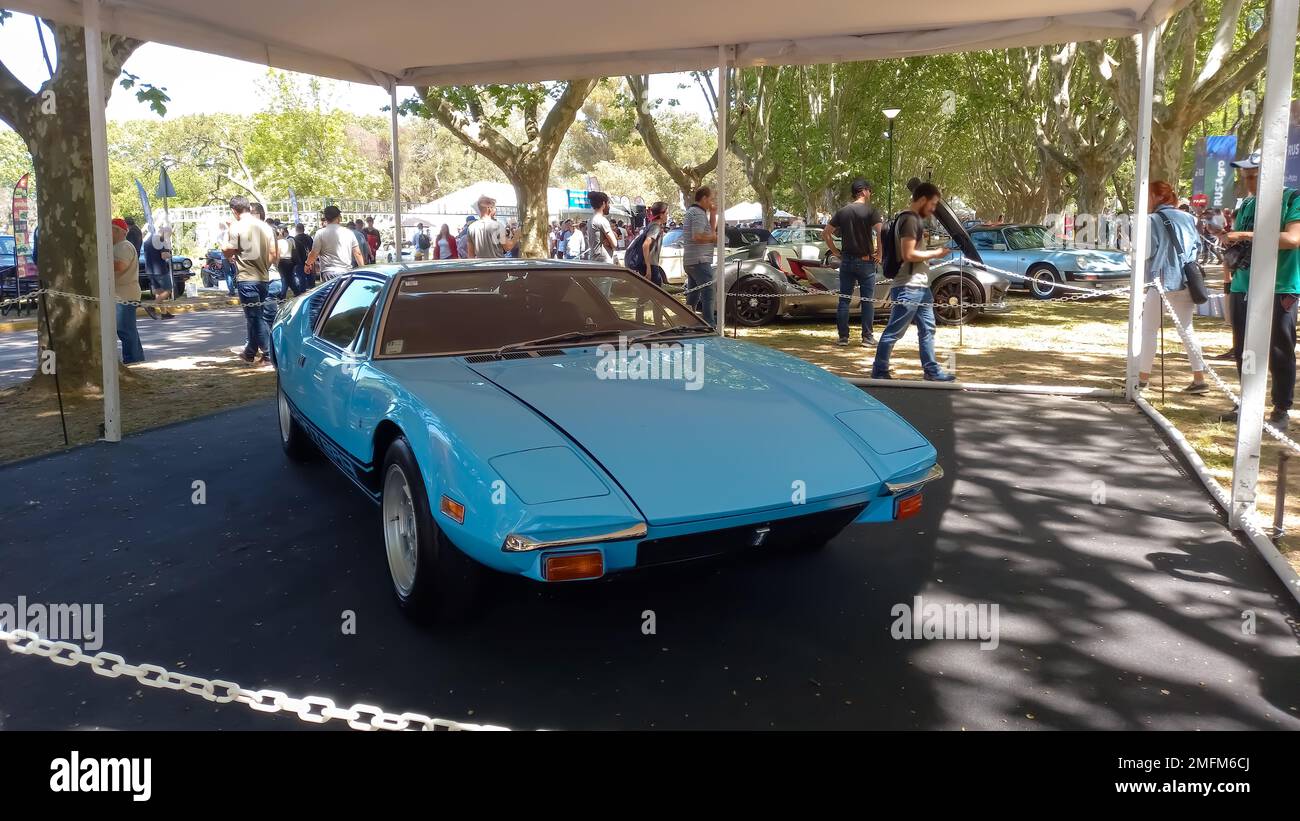 San Isidro, Argentina - Oct 7, 2022: Old sport sky blue 1979 De Tomaso Pantera in a park. Nature ...