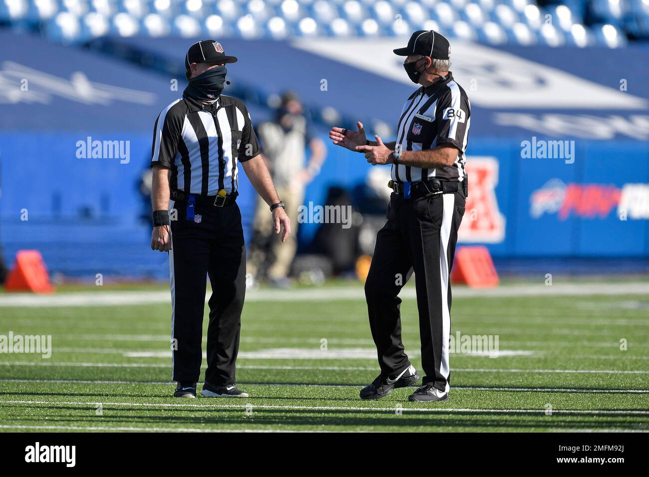 Down judge Michael Dolce (123) and line judge Mark Steinkerchner (84 ...