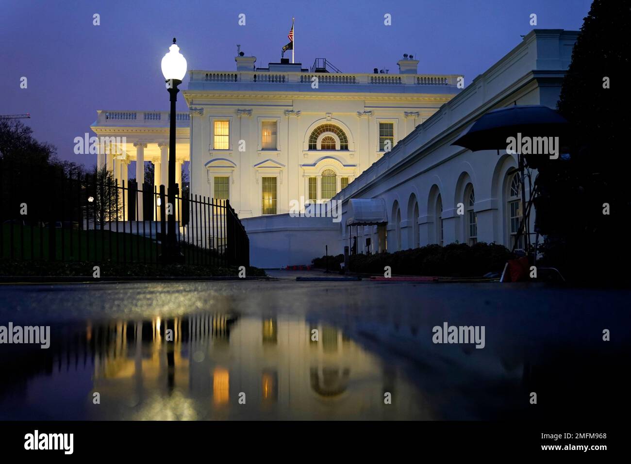 Lights shine from inside the White House at dusk, Wednesday, Nov. 11 ...