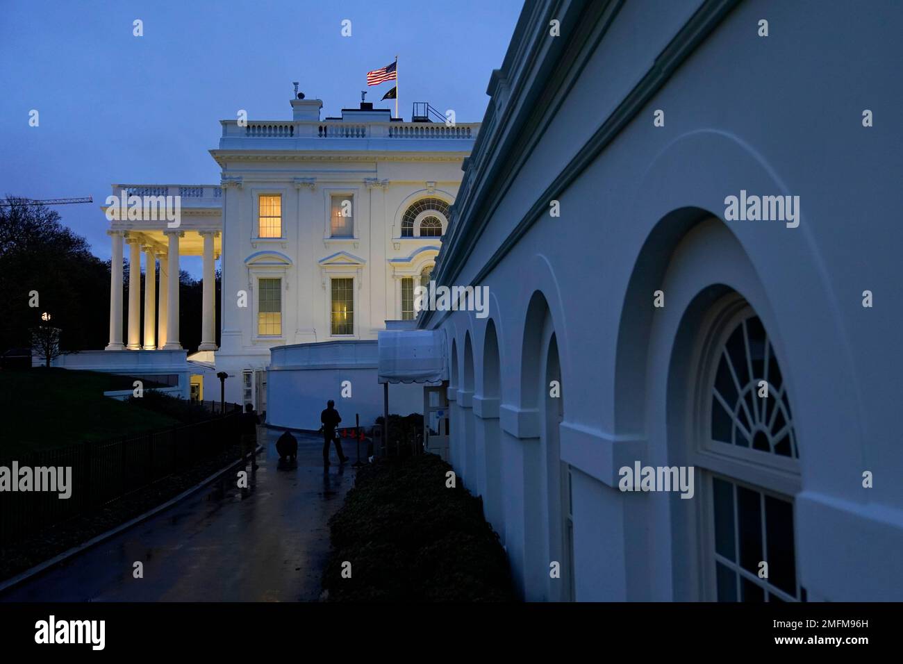 Lights shine from inside the White House at dusk, Wednesday, Nov. 11 ...