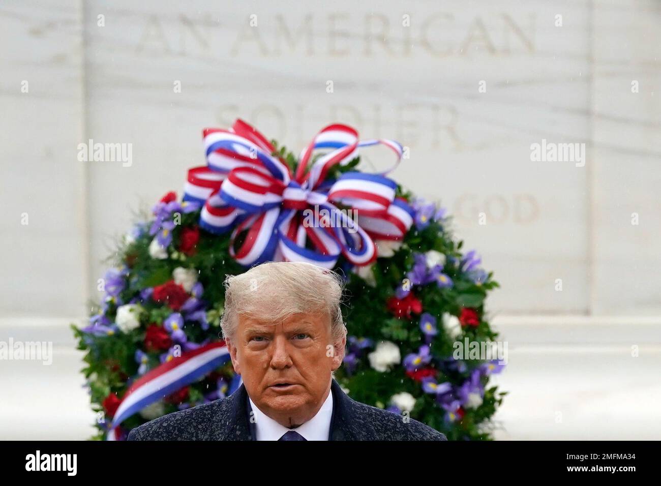 President Donald Trump participates in a Veterans Day wreath laying ...