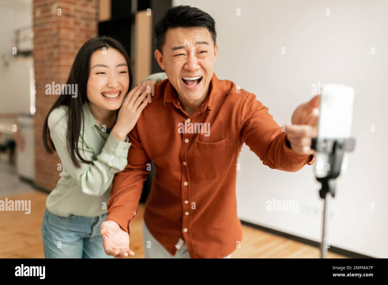 Overjoyed millennial married couple hi-res stock photography and images - Alamy