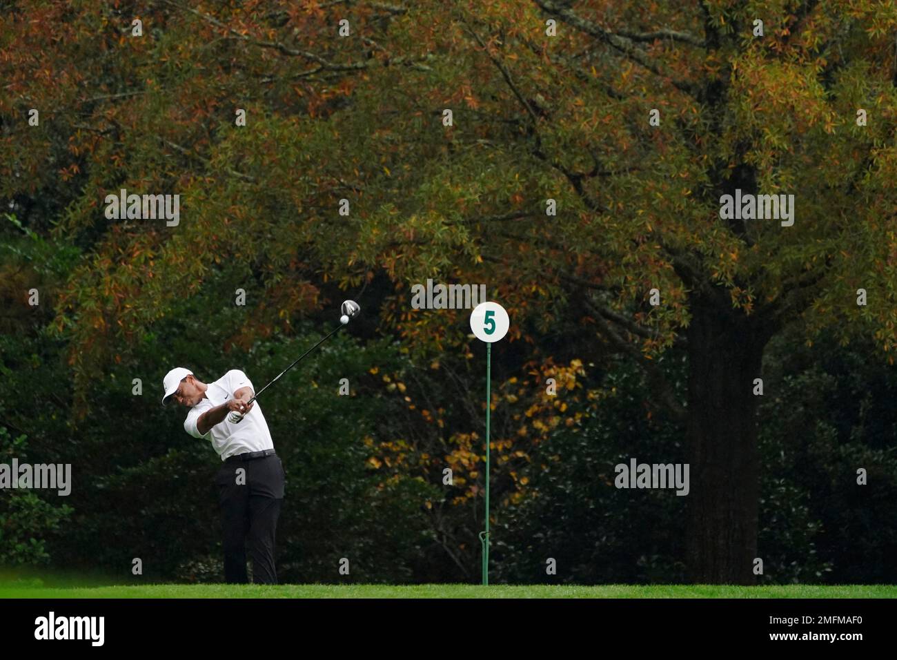 Tiger Woods tees off at the fifth hole during a practice round for the ...