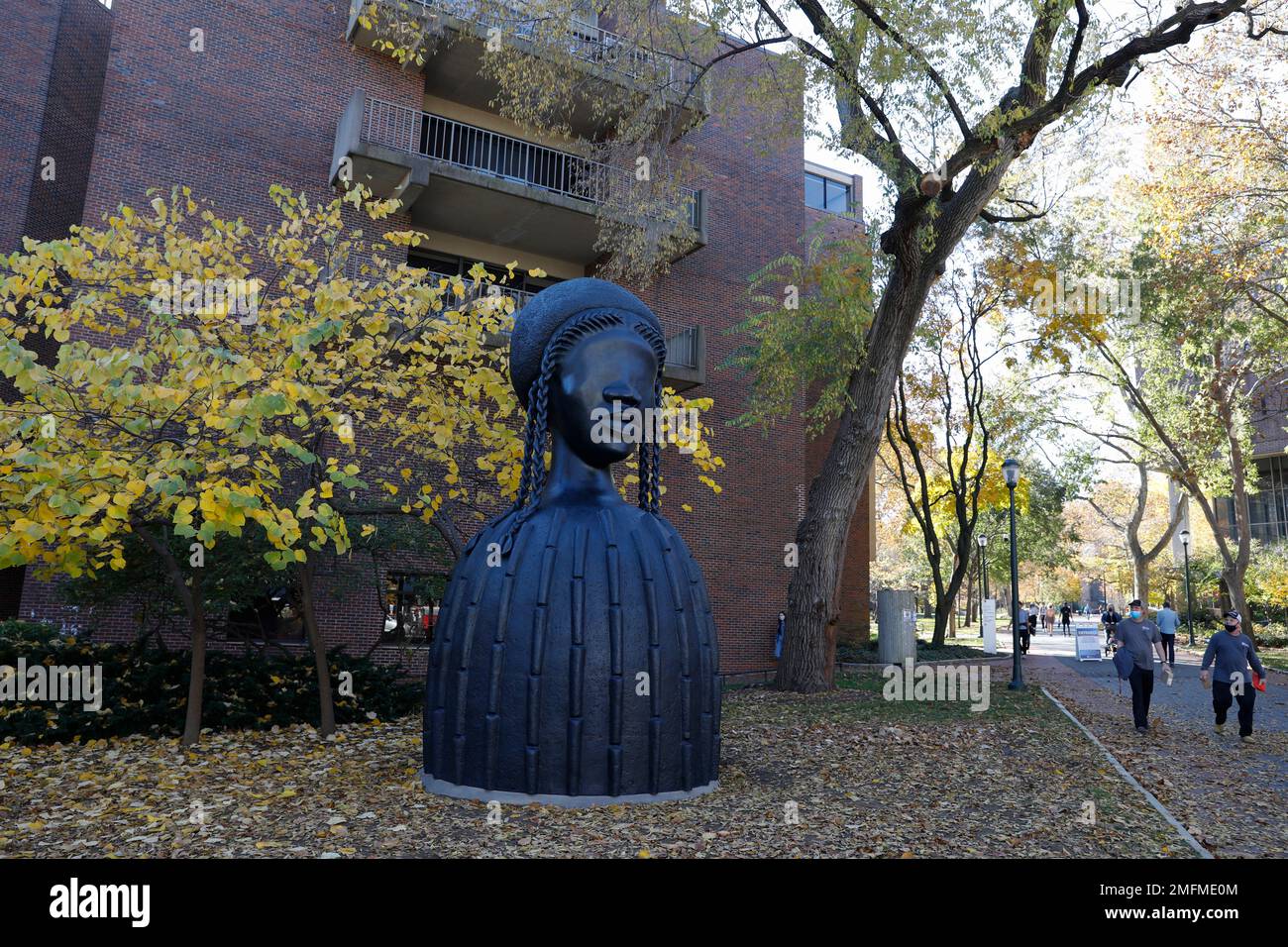 People walk past a newly installed sculpture by artist Simone Leigh on ...