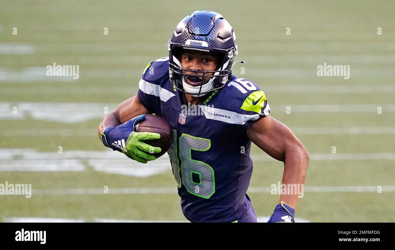 Seattle Seahawks' Tyler Lockett runs with the ball against the San ...