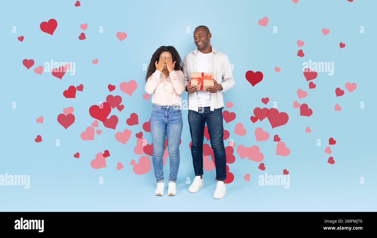 Celebration concept. Happy black woman covering her eyes with hands ...