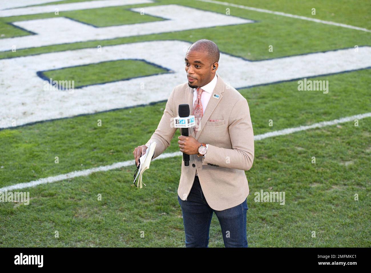 Big Ten Network sideline reporter Coley Harvey reports during an NCAA ...