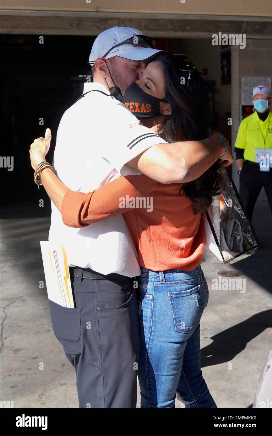 Texas head coach Tom Herman hugs his wife, Michelle, before an NCAA ...