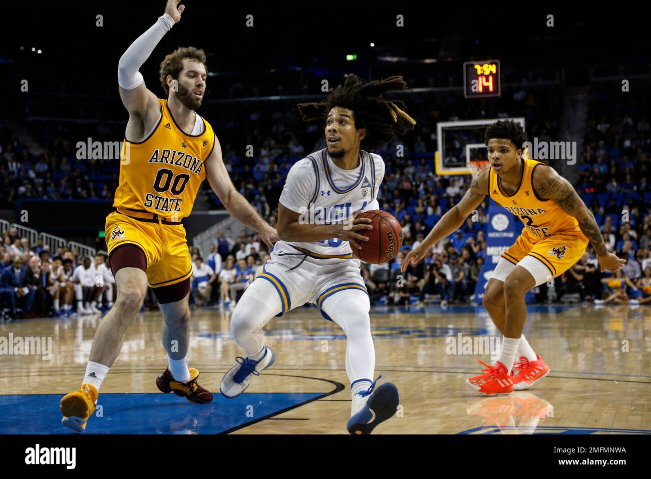 FILE - In this Thursday, Feb. 27, 2020, file photo, UCLA guard Tyger ...