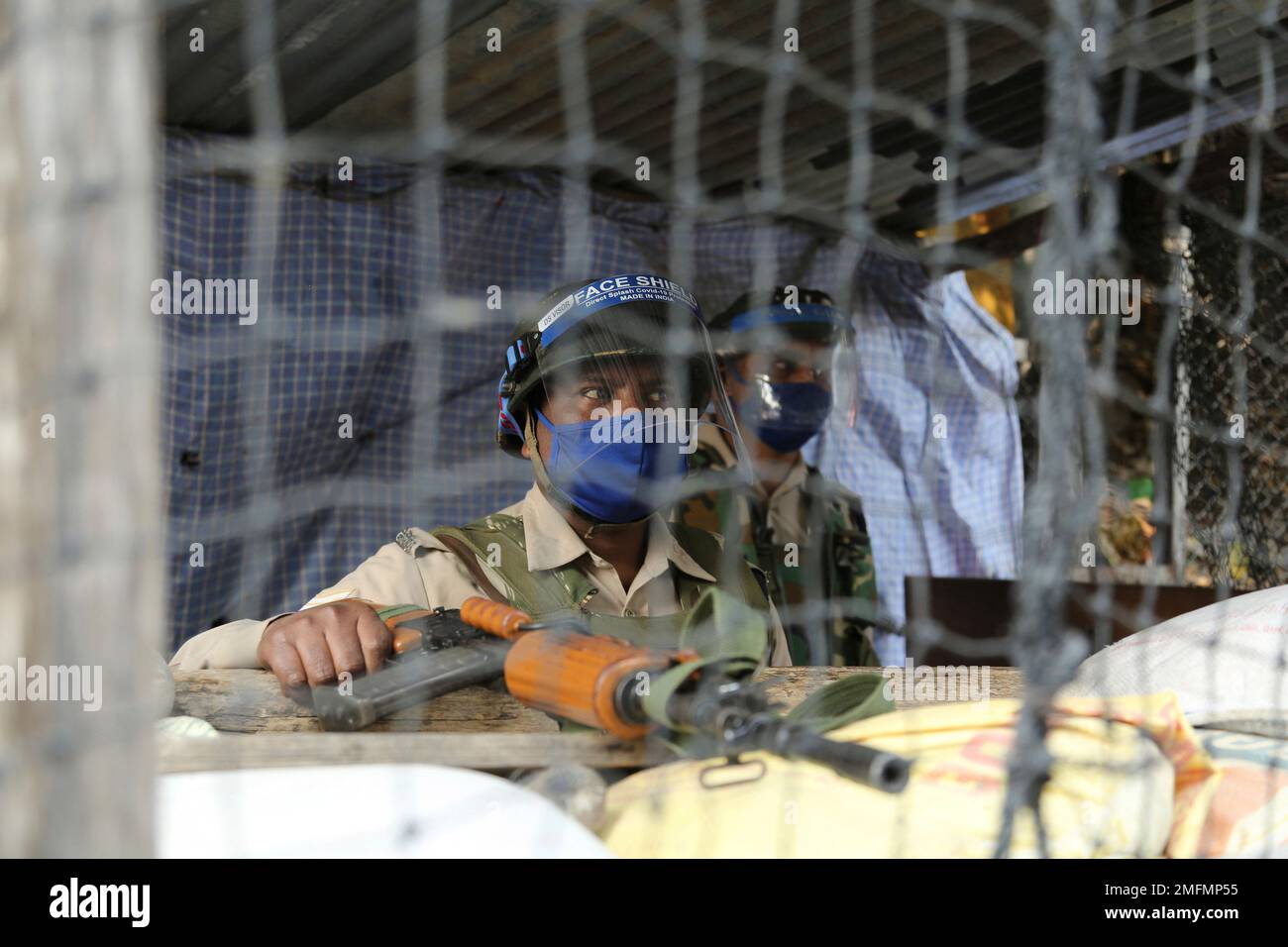 Indian security personnel guard outside the civil secretariat of the ...