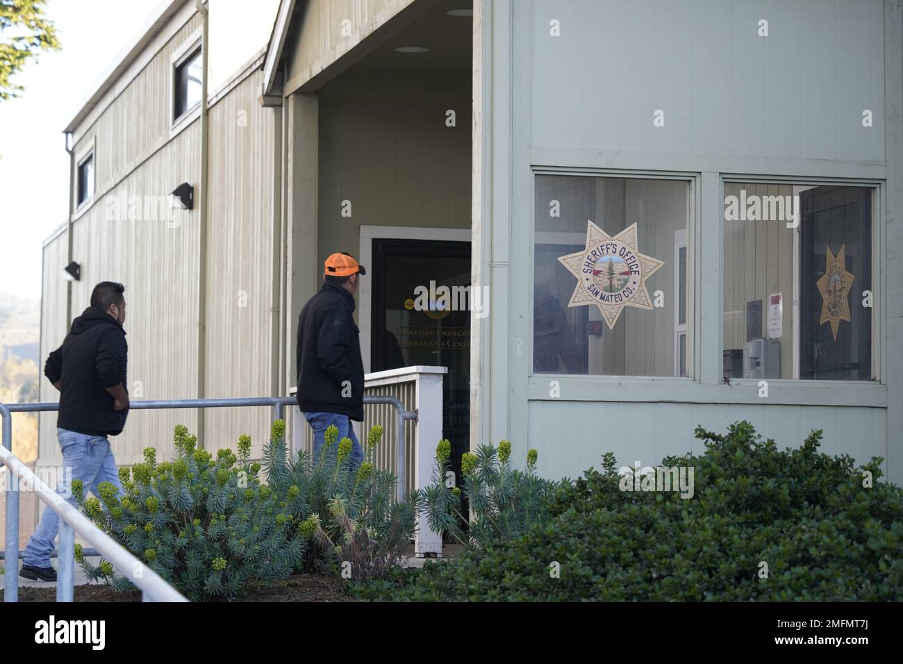 San Francisco, USA. 24th Jan, 2023. Two men walk into a San Mateo ...