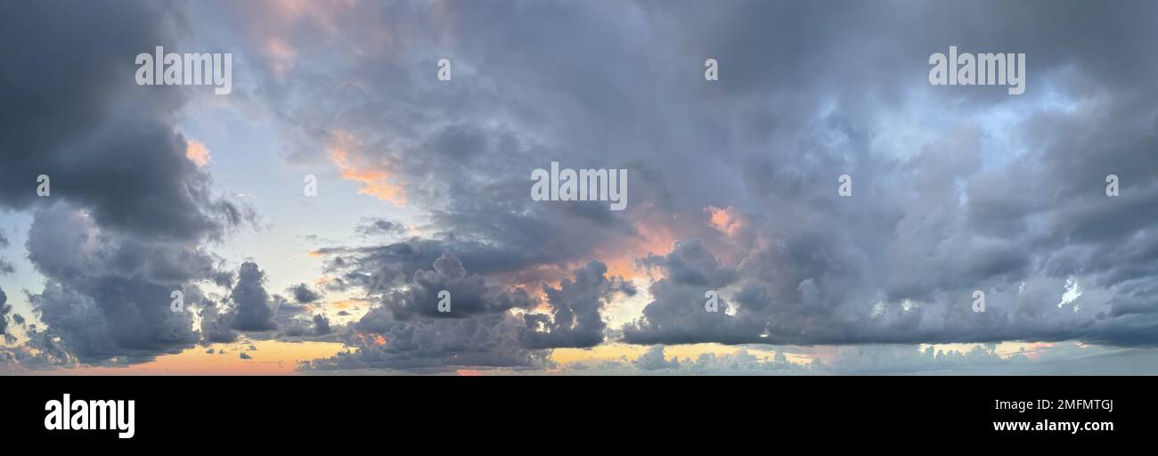 Vibrant color panorama of sky with dramatic cloud. Beautiful sunset ...