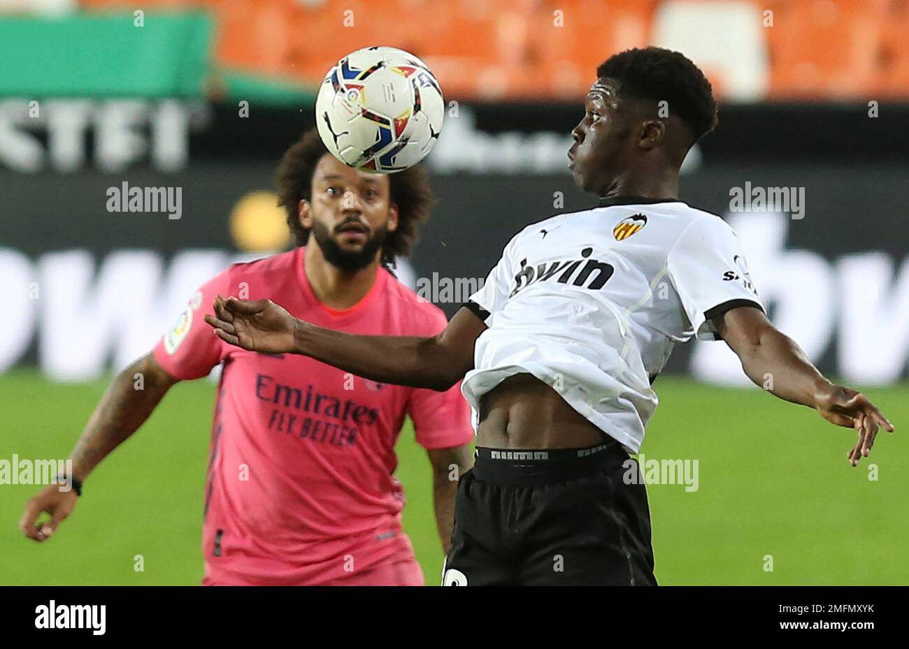 Valencia's Yunus Musah, right, and Real Madrid's Marcelo fight for the ...