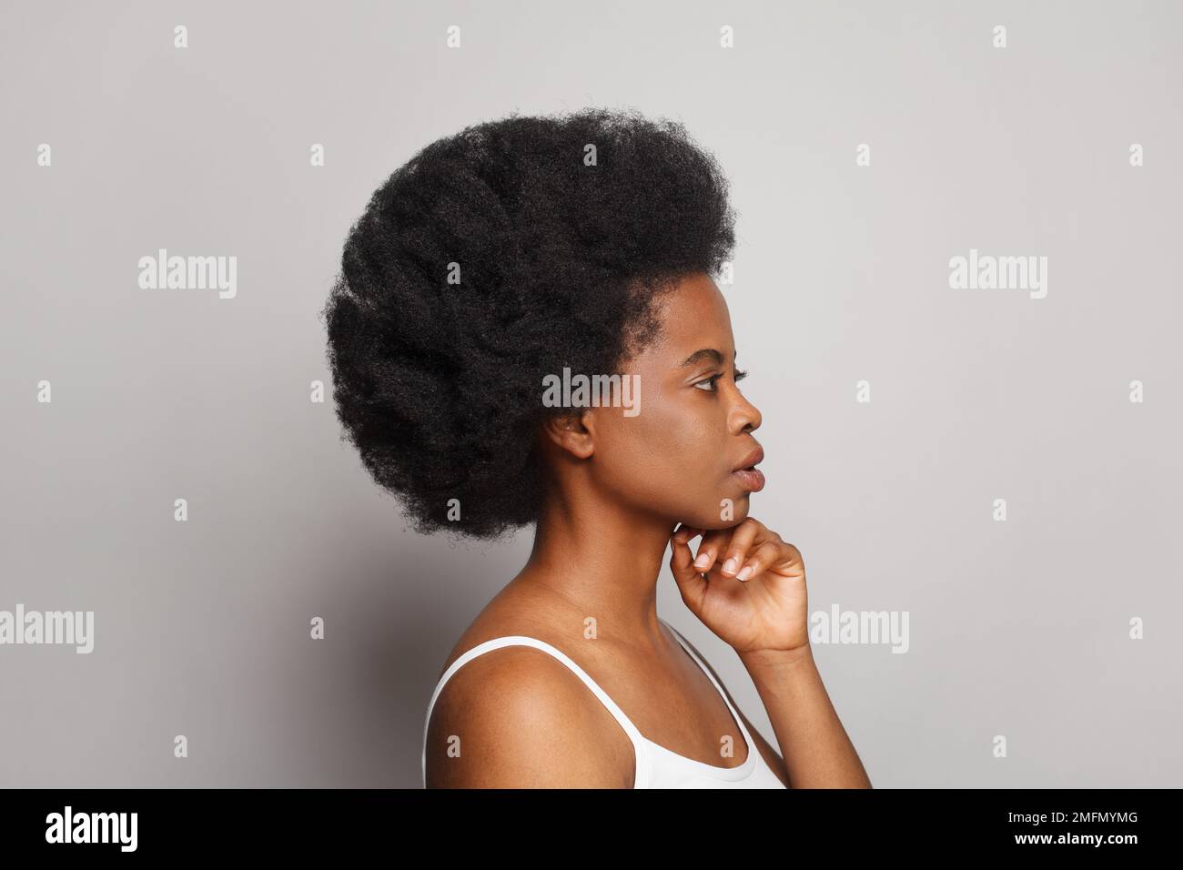 Beautiful female profile on light studio wall background Stock Photo ...