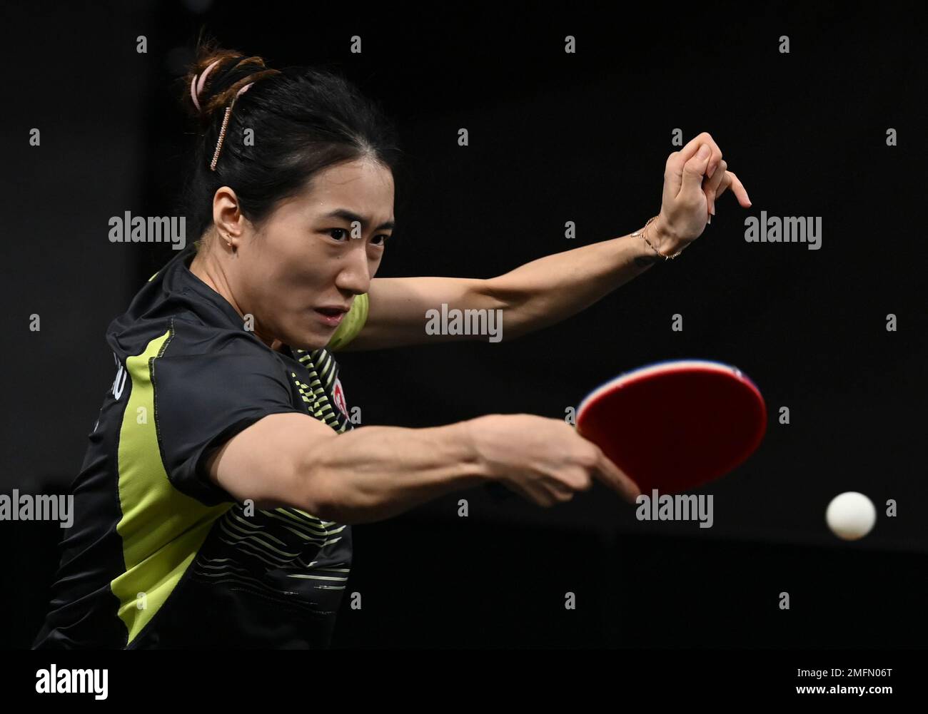 Doha, Qatar. 25th Jan, 2023. Zhu Chengzhu of China's Hong Kong hits a ...