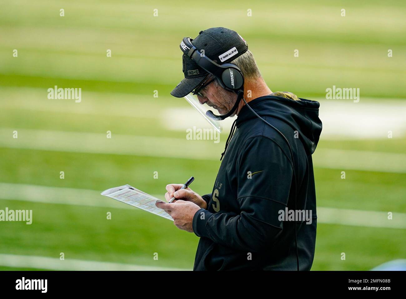 Indianapolis Colts head coach Frank Reich takes notes on the sideline ...