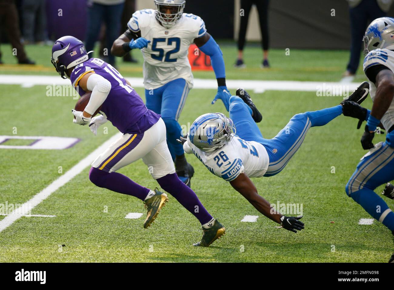 Minnesota Vikings wide receiver Adam Thielen, left, runs from Detroit ...